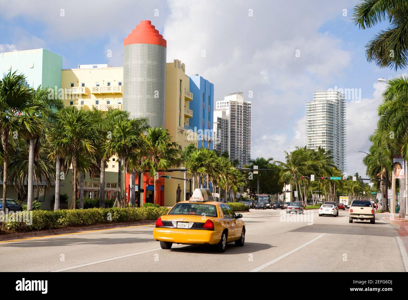 Cars on the road with buildings in the background, South Beach, Miami ...