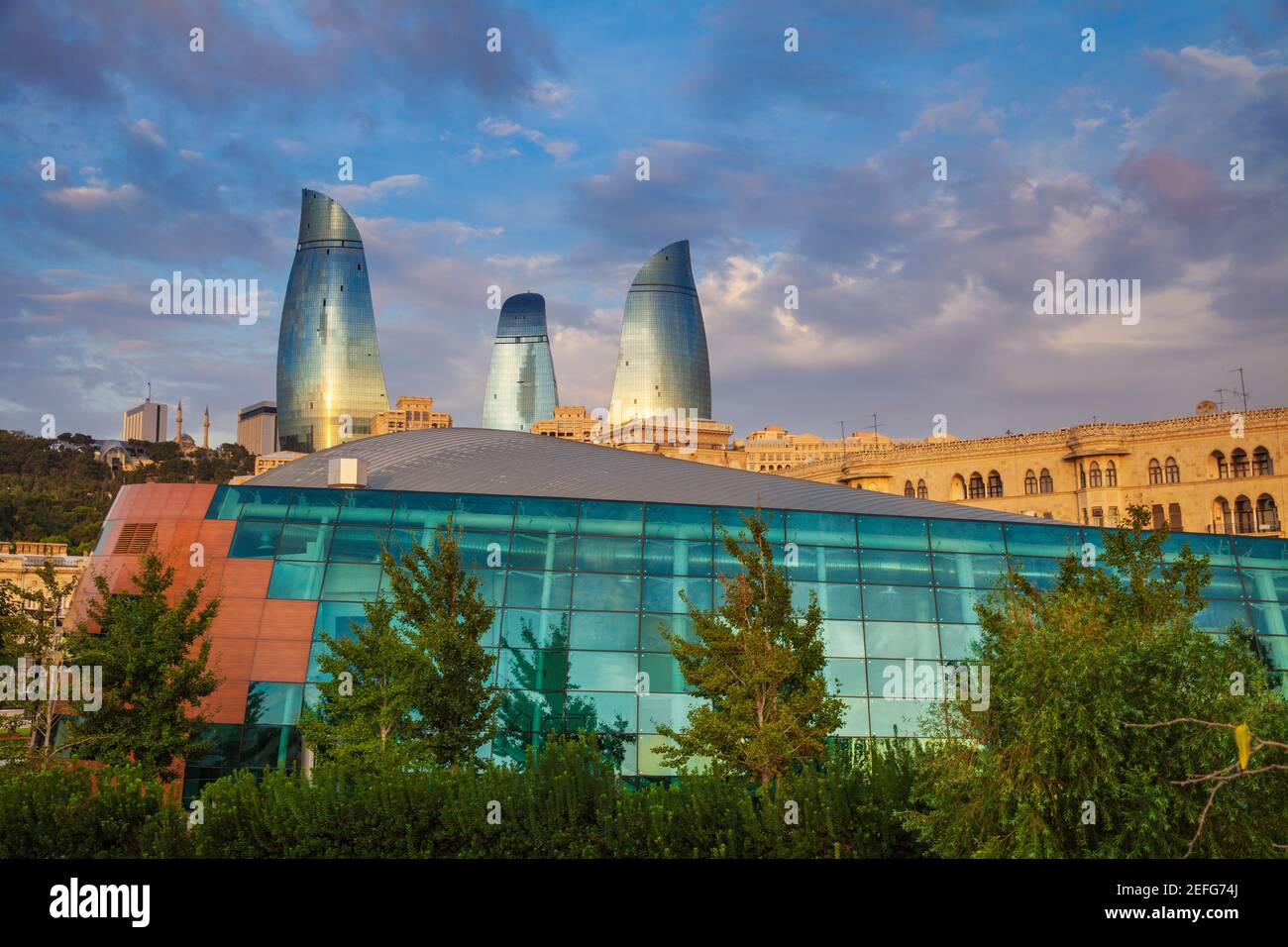 Azerbaijan, Baku, Flame Towers behind International Mugham Center Stock ...