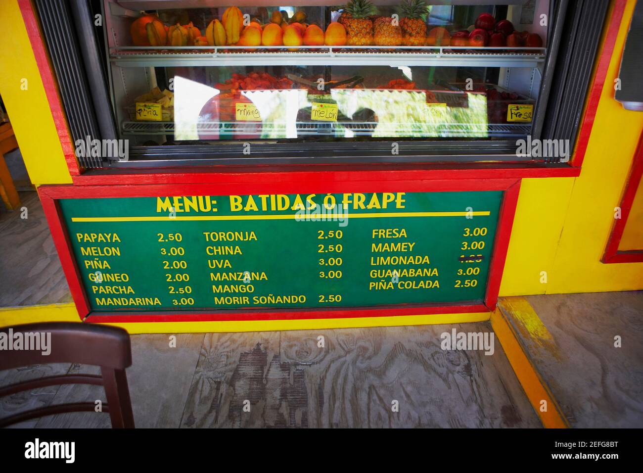 Display cabinet and a menu at a juice bar Stock Photo - Alamy