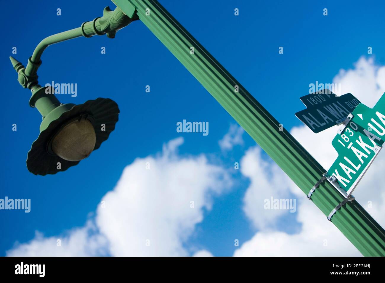 Low angle view of a signboard on a street light, Honolulu, Oahu, Hawaii ...