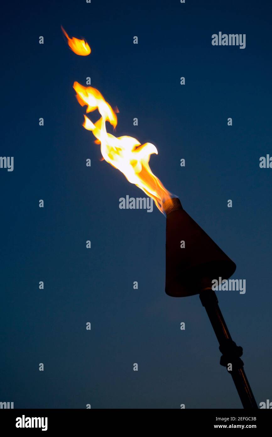 Close-up of a burning flaming torch Stock Photo - Alamy