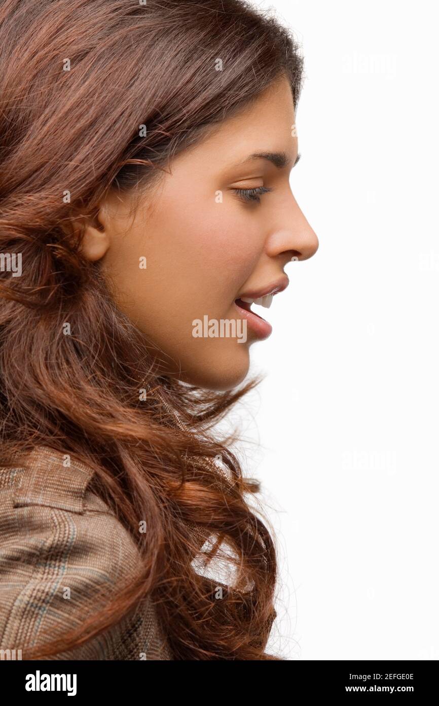 Side profile of a young woman smiling Stock Photo - Alamy