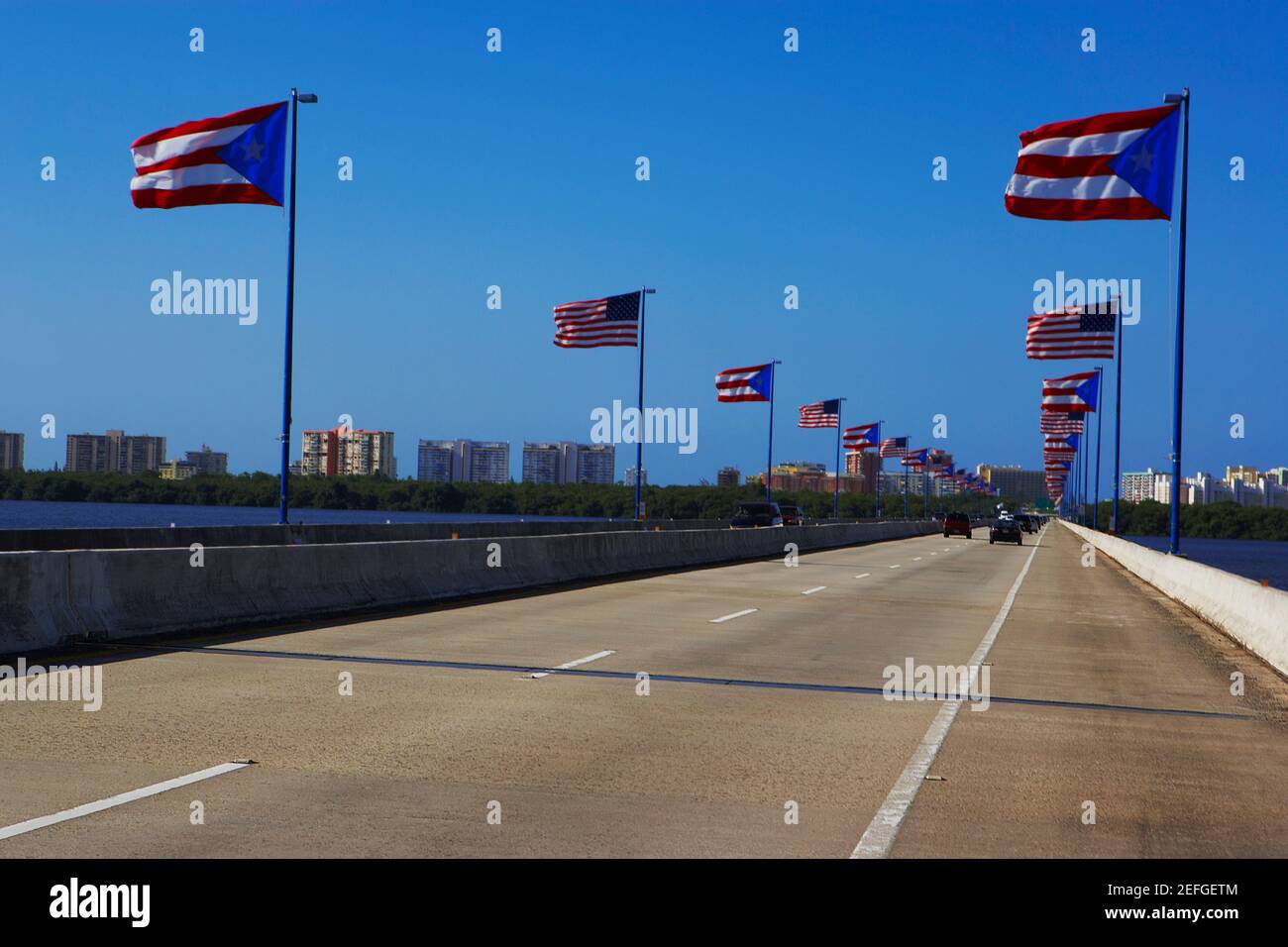 Puerto Rican and American flags on both sides of a bridge, Puerto Rico ...