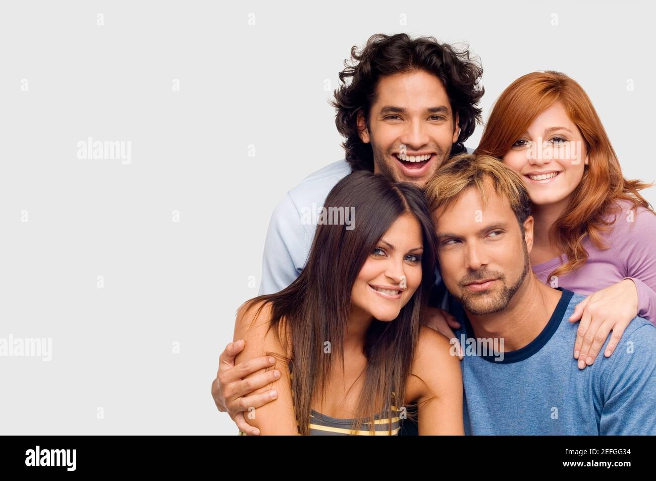Close-up of a young man smiling with his friends Stock Photo - Alamy