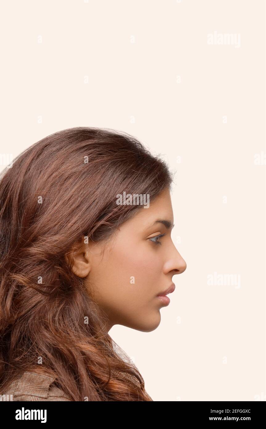 Side profile of a young woman thinking Stock Photo - Alamy