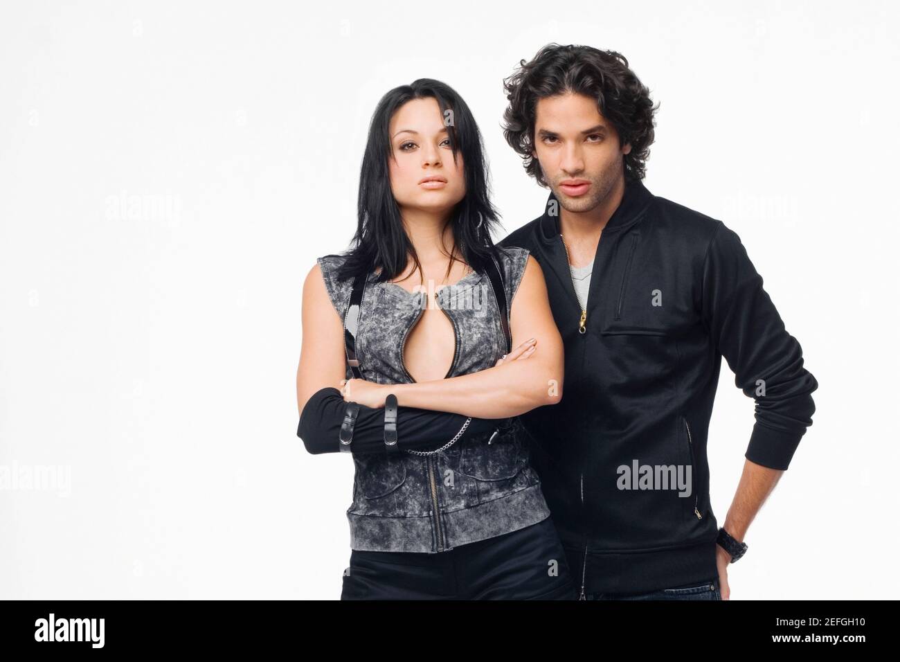 Portrait of a young couple looking confident Stock Photo - Alamy