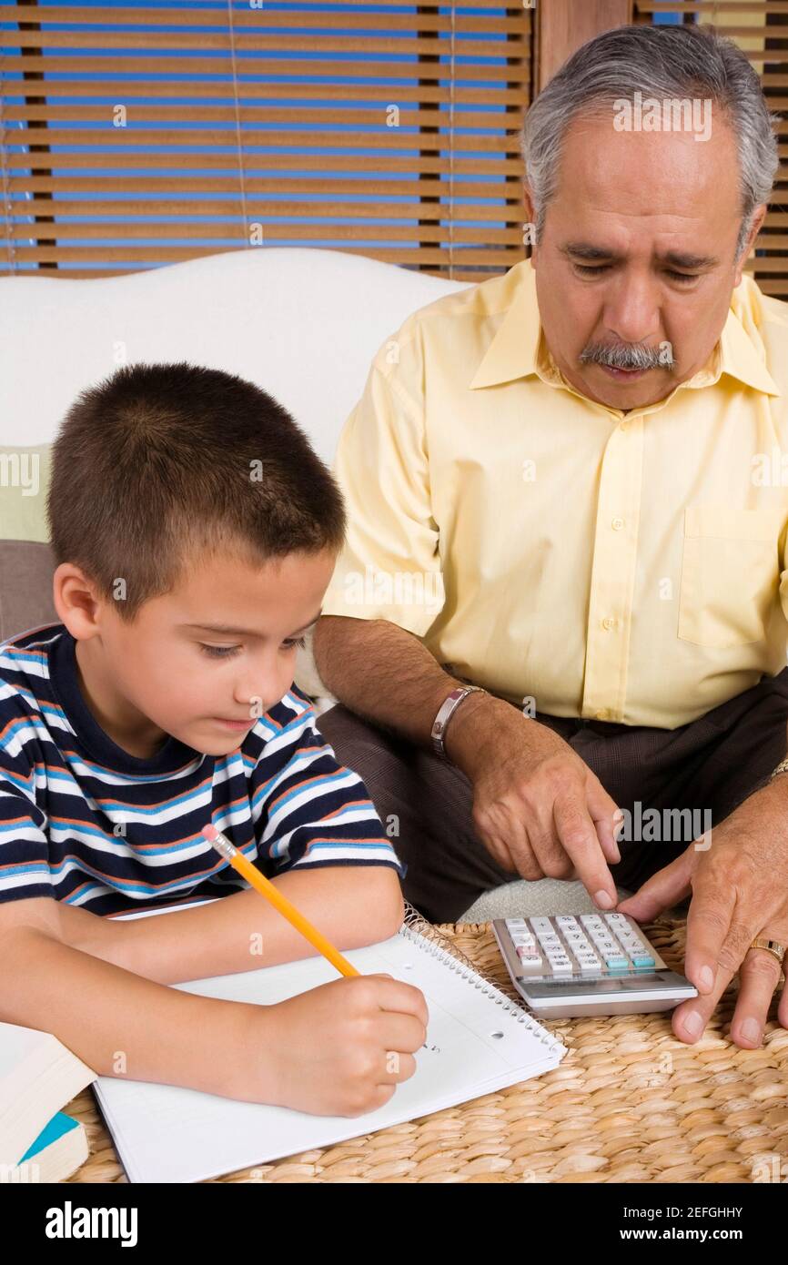 Senior man teaching his grandson Stock Photo - Alamy