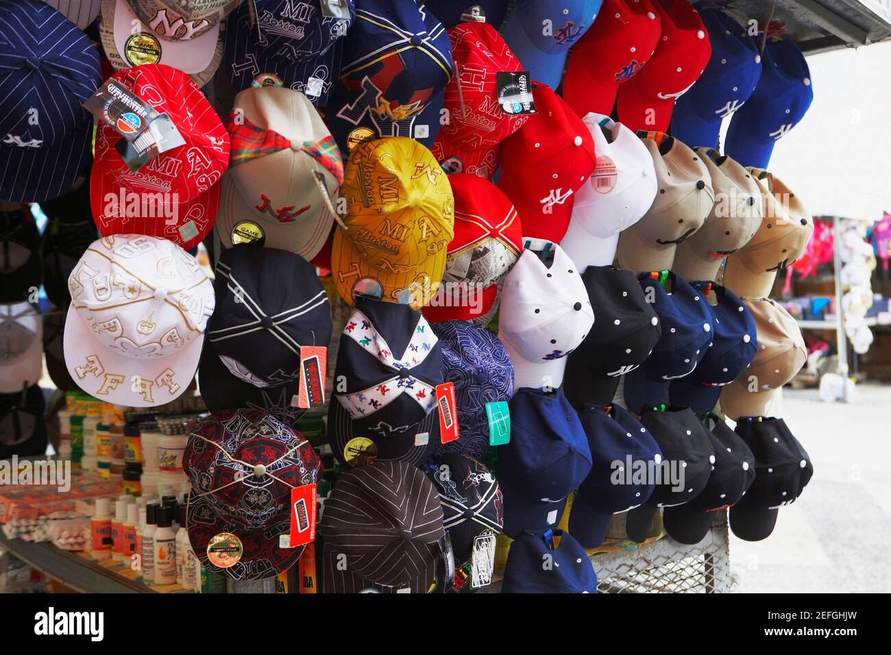Multi-colored baseball caps at a market stall, Rio Piedras, San Juan ...