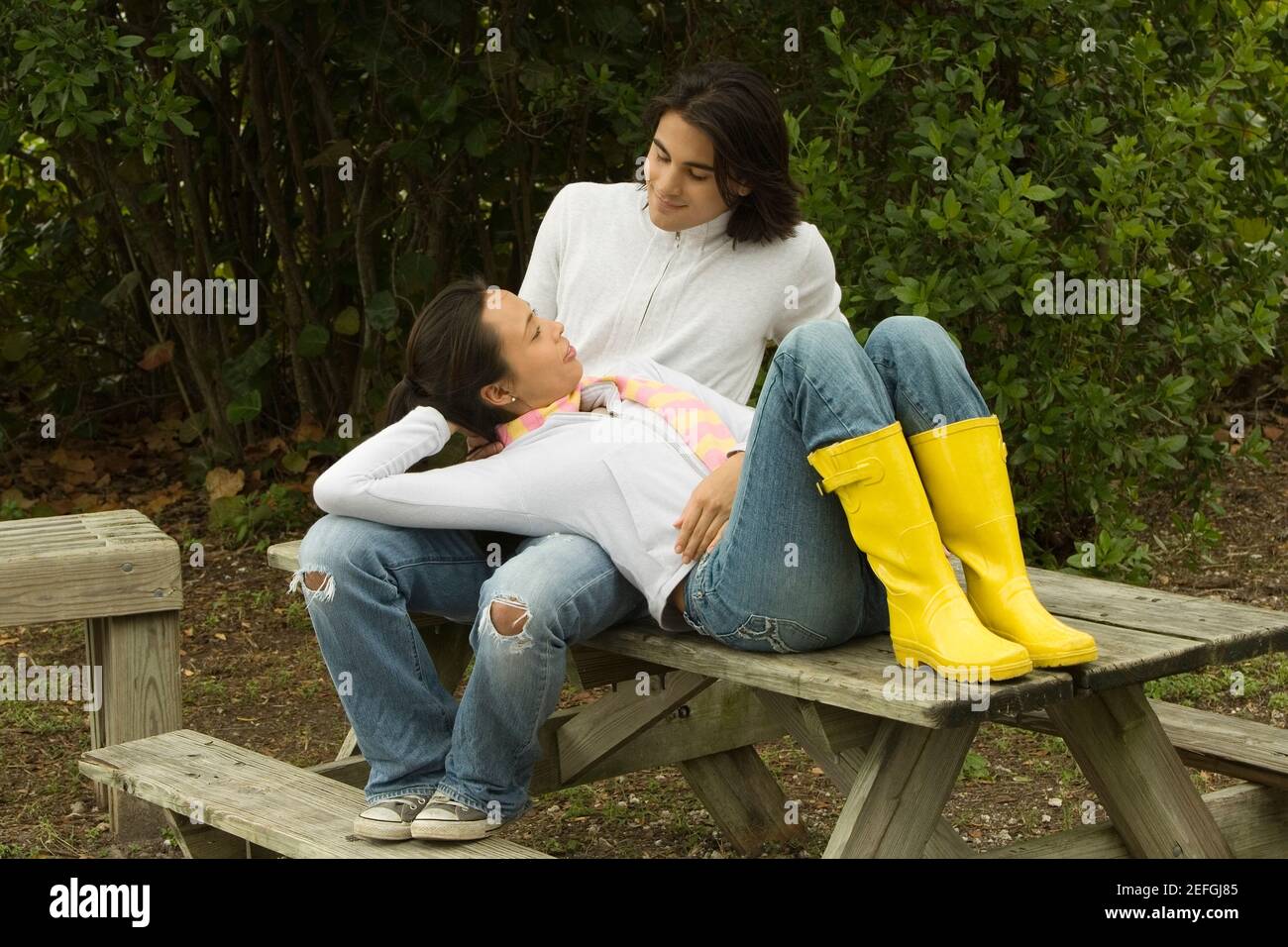 Man sitting with woman lying on lap hi-res stock photography and images ...