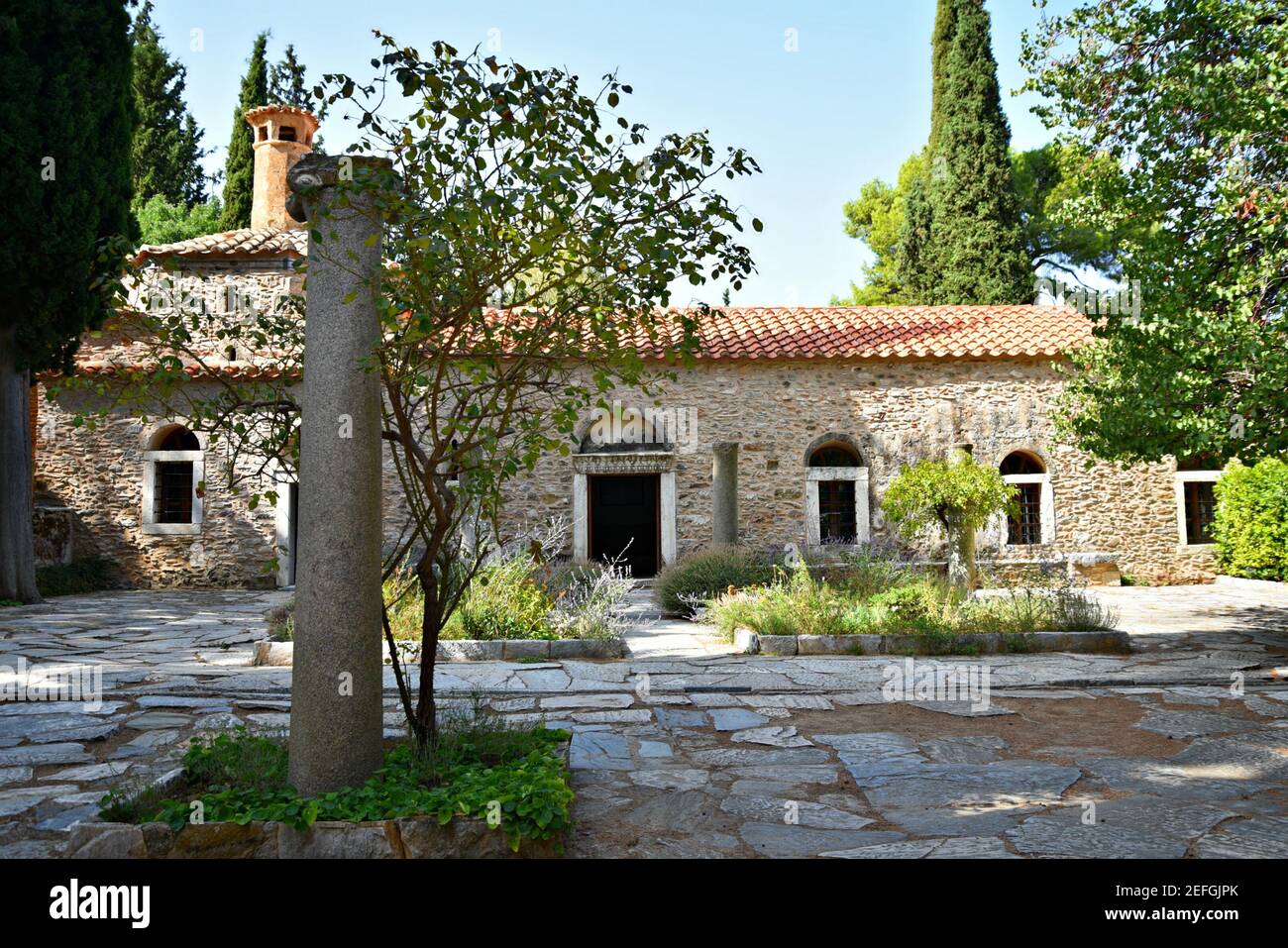 Reflectory view of the historic Eastern Orthodox Kaisariani Monastery ...