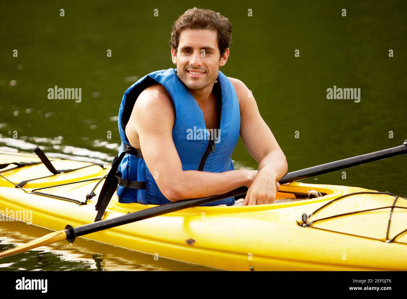 Man sitting in kayak in hi-res stock photography and images - Alamy