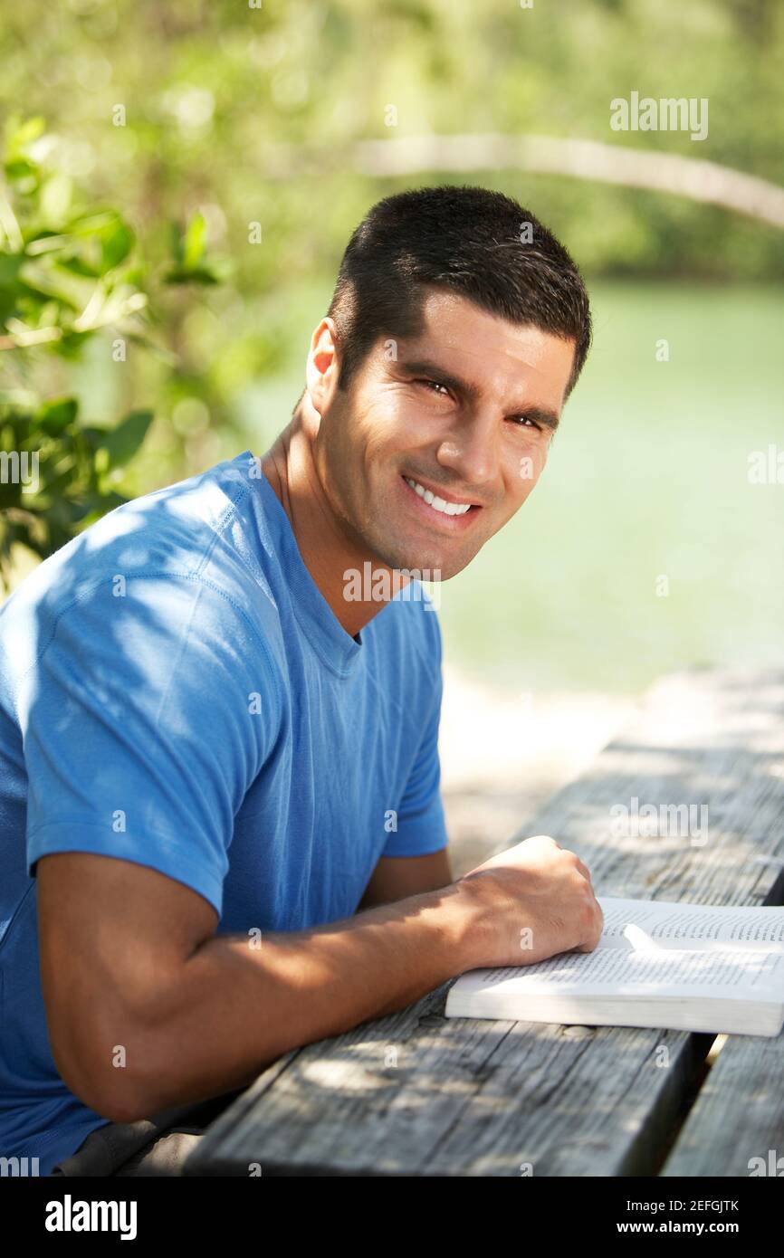 Side profile of a mid adult man smiling Stock Photo - Alamy