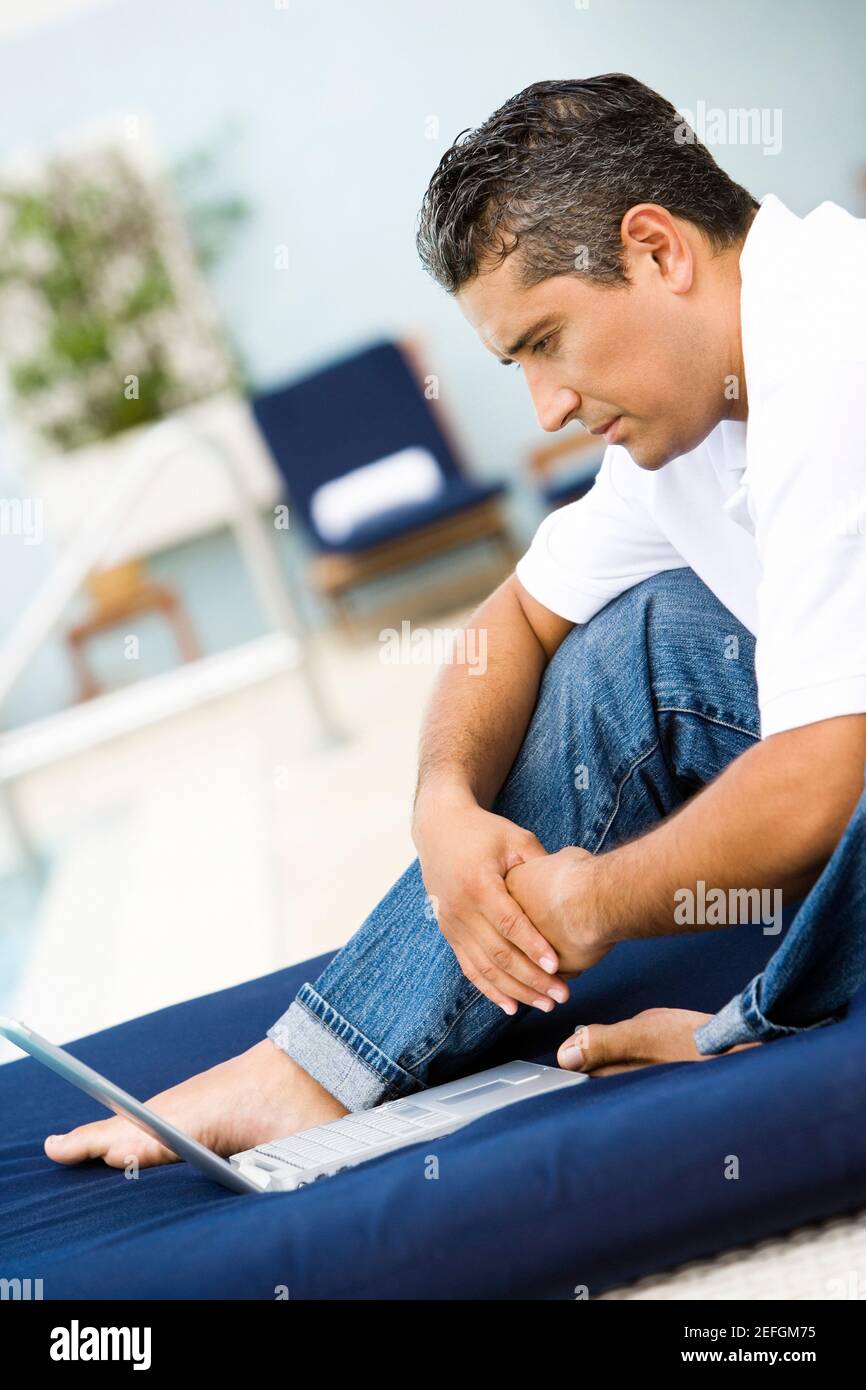 Middle aged black man using laptop hi-res stock photography and images ...