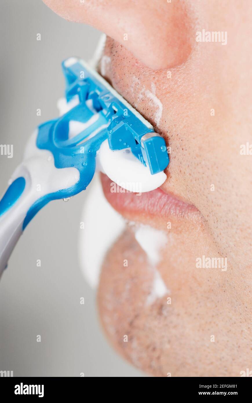 Close up young man applying hi-res stock photography and images - Alamy
