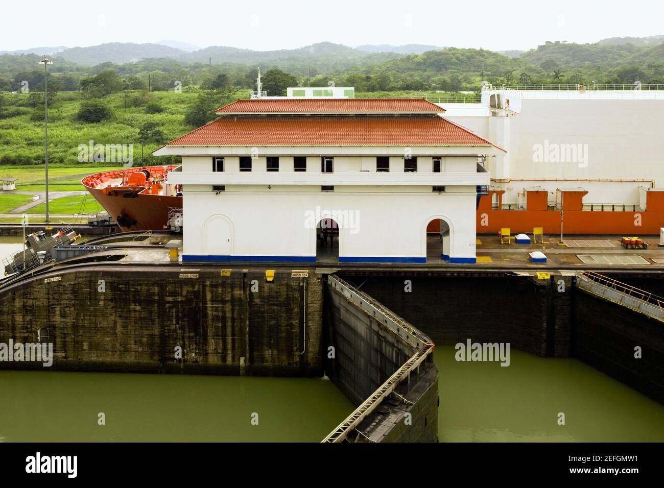 Building near a dam, Miraflores Locks, Panama Canal, Panama Stock Photo ...
