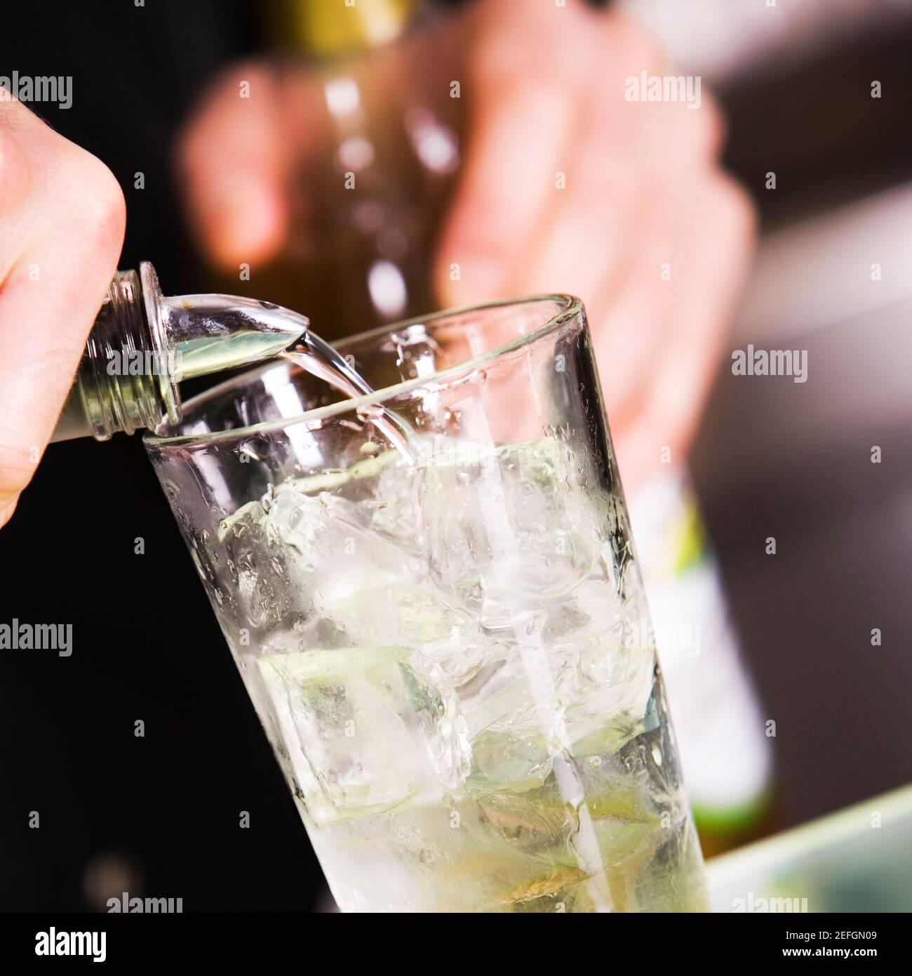 Man pouring alcohol hi-res stock photography and images - Alamy