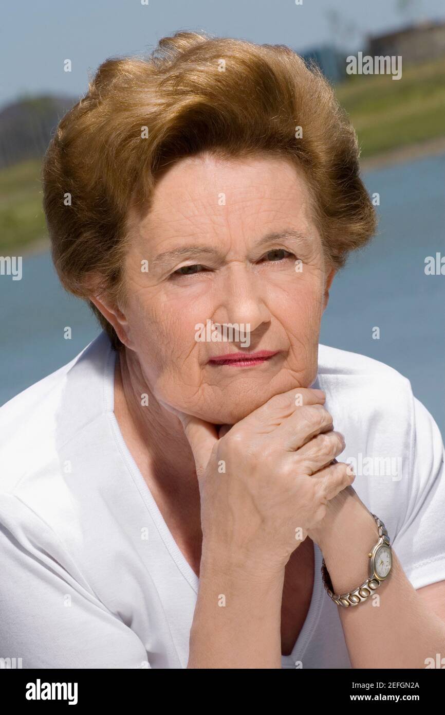 Portrait of a senior woman thinking Stock Photo - Alamy