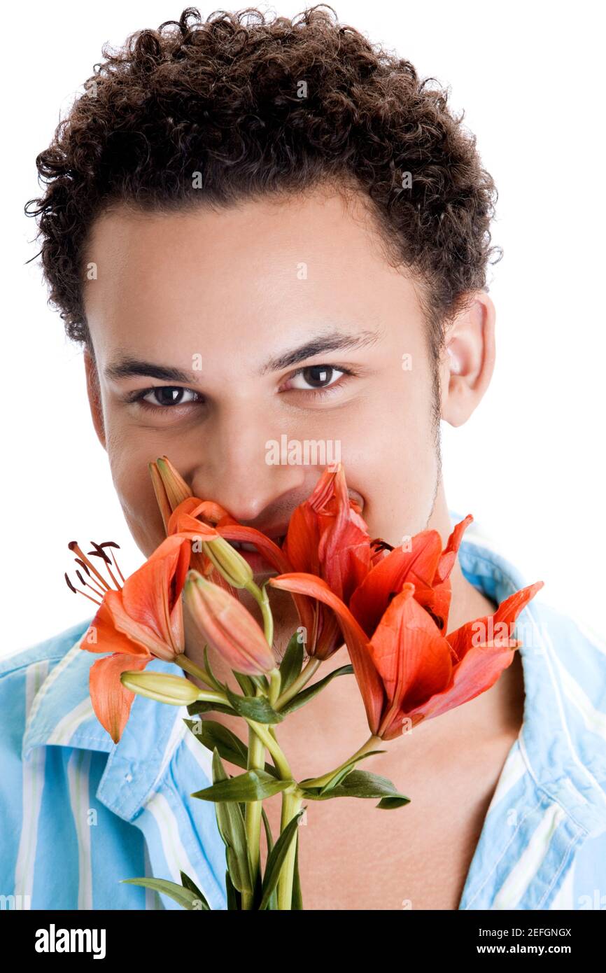 Man sniffing a flower hi-res stock photography and images - Alamy