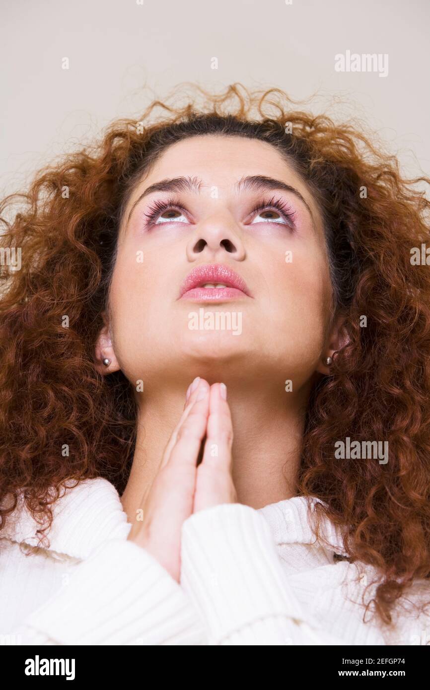 Low angle view of a young woman looking up Stock Photo - Alamy