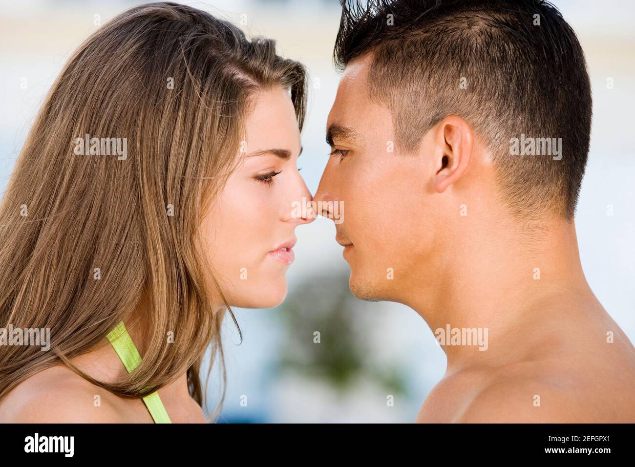 Side profile of a young couple rubbing their noses Stock Photo - Alamy