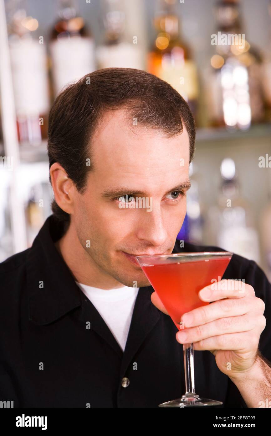 Man drinking martini hi-res stock photography and images - Alamy