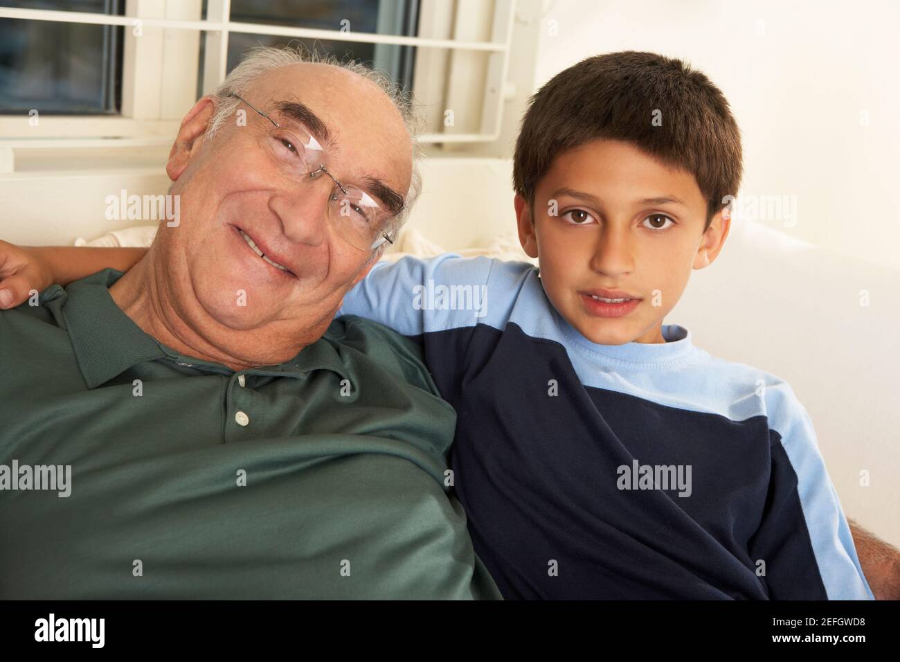 Portrait of a grandfather smiling with his grandson Stock Photo - Alamy
