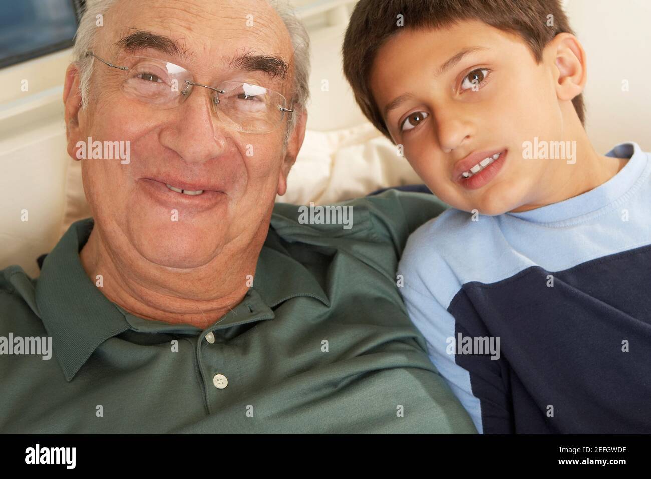 Portrait of a grandfather smiling with his grandson Stock Photo - Alamy