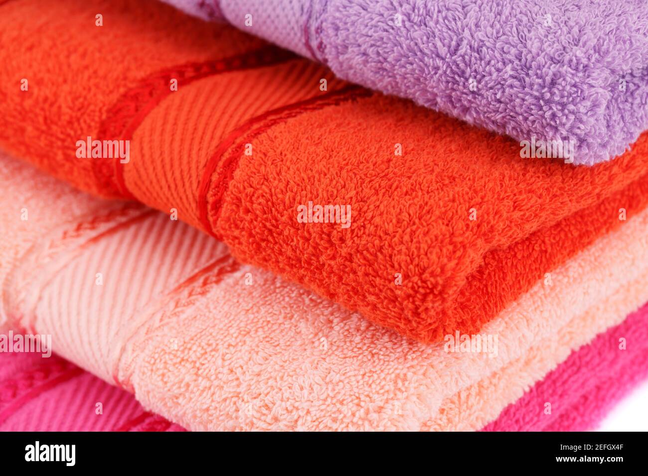 Colorful towels stack closeup picture Stock Photo - Alamy