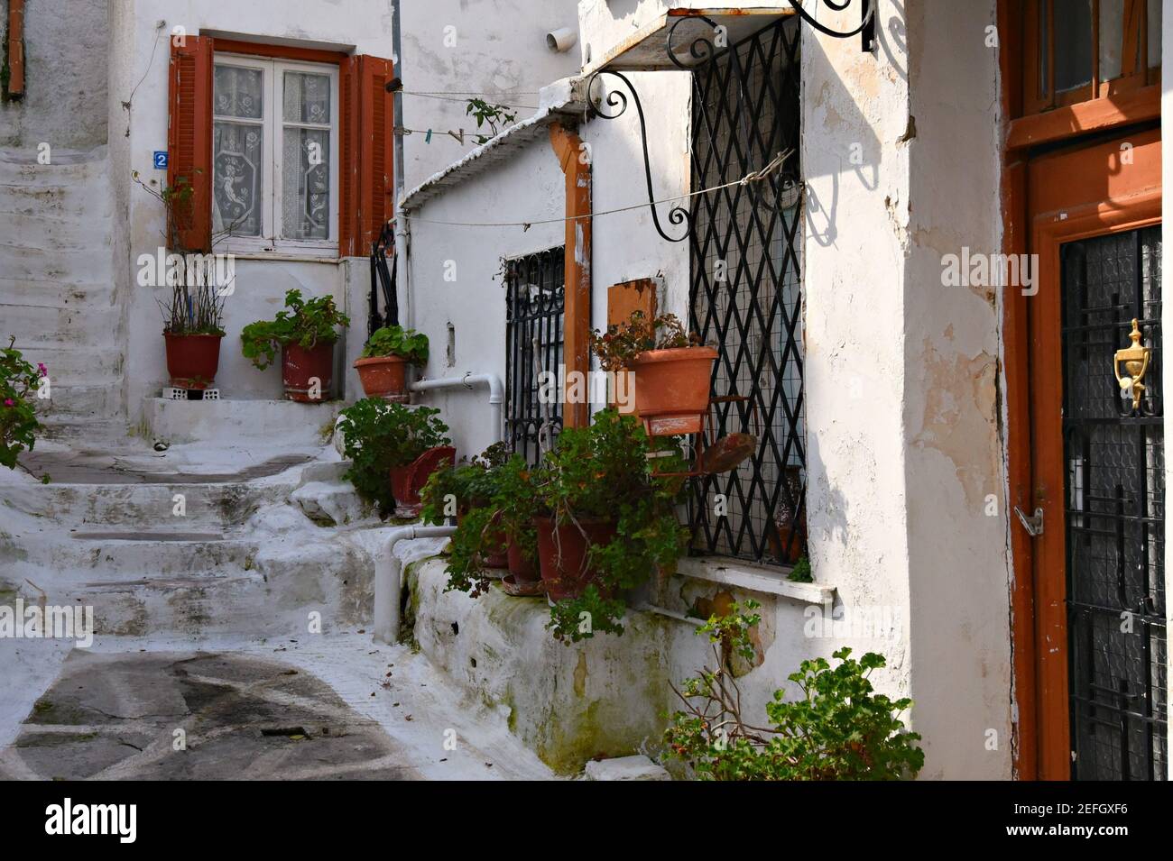 Traditional old house with a weathered whitewashed wall and wooden ...