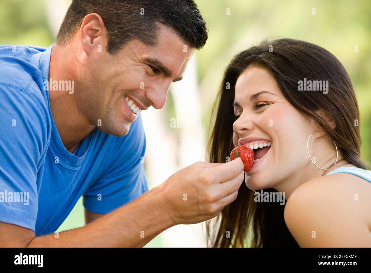 Adult caucasian casual man feeding hi-res stock photography and images ...
