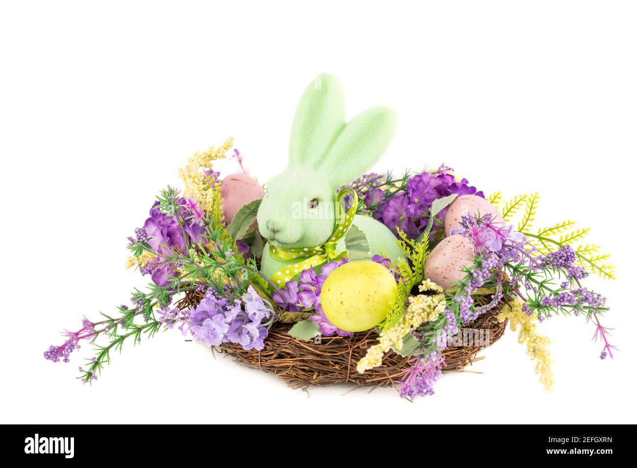 Easter colorful eggs and bunny in nest, flowers isolated on white ...