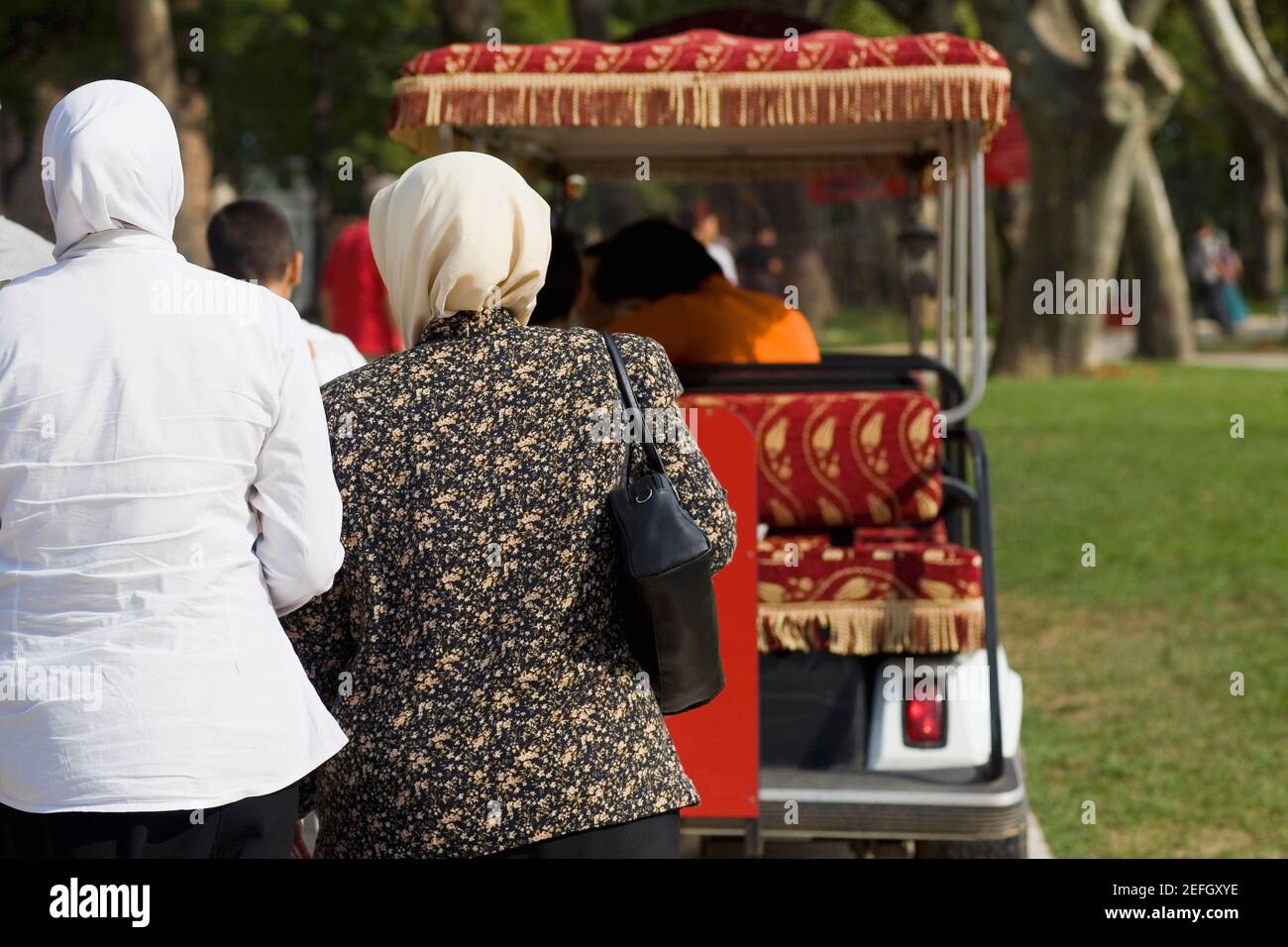 Rear view of two women in grass hi-res stock photography and images - Alamy