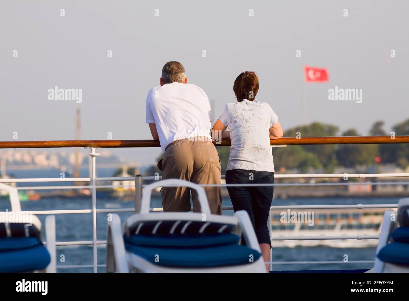 Rear view of a couple leaning over a railing, Istanbul, Turkey Stock ...