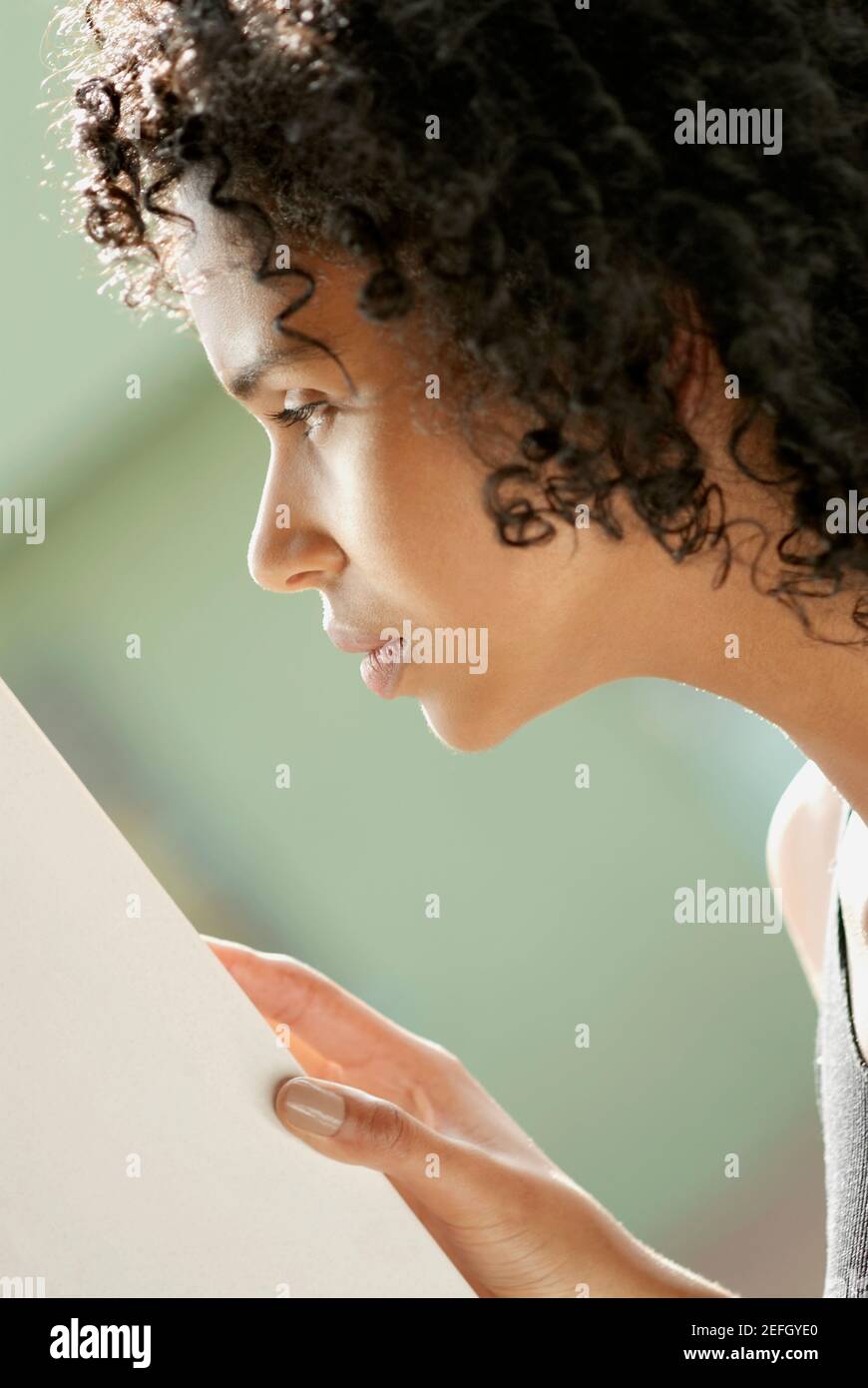 Side profile of a young woman looking serious Stock Photo - Alamy