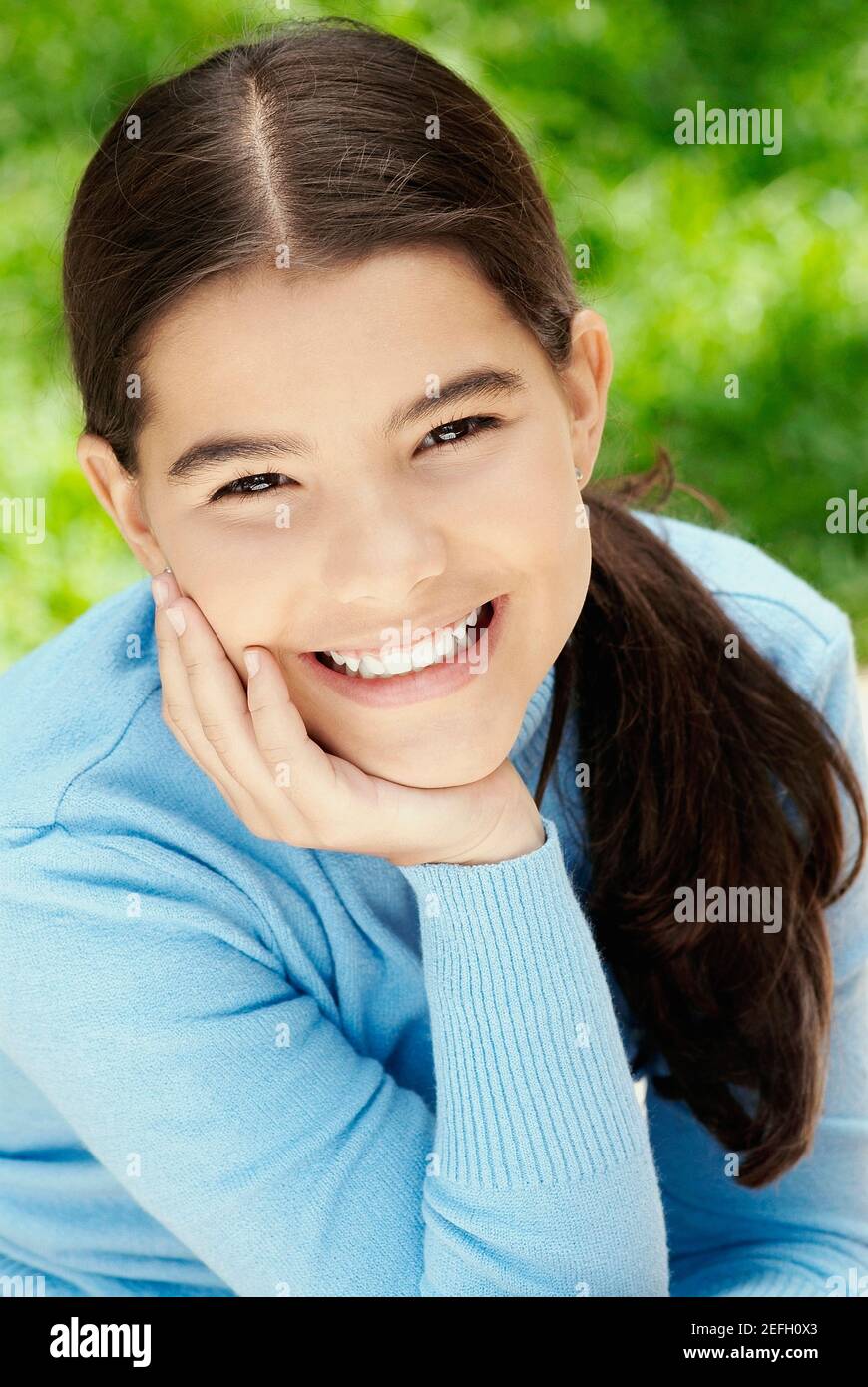 Portrait of a teenage girl smiling Stock Photo - Alamy