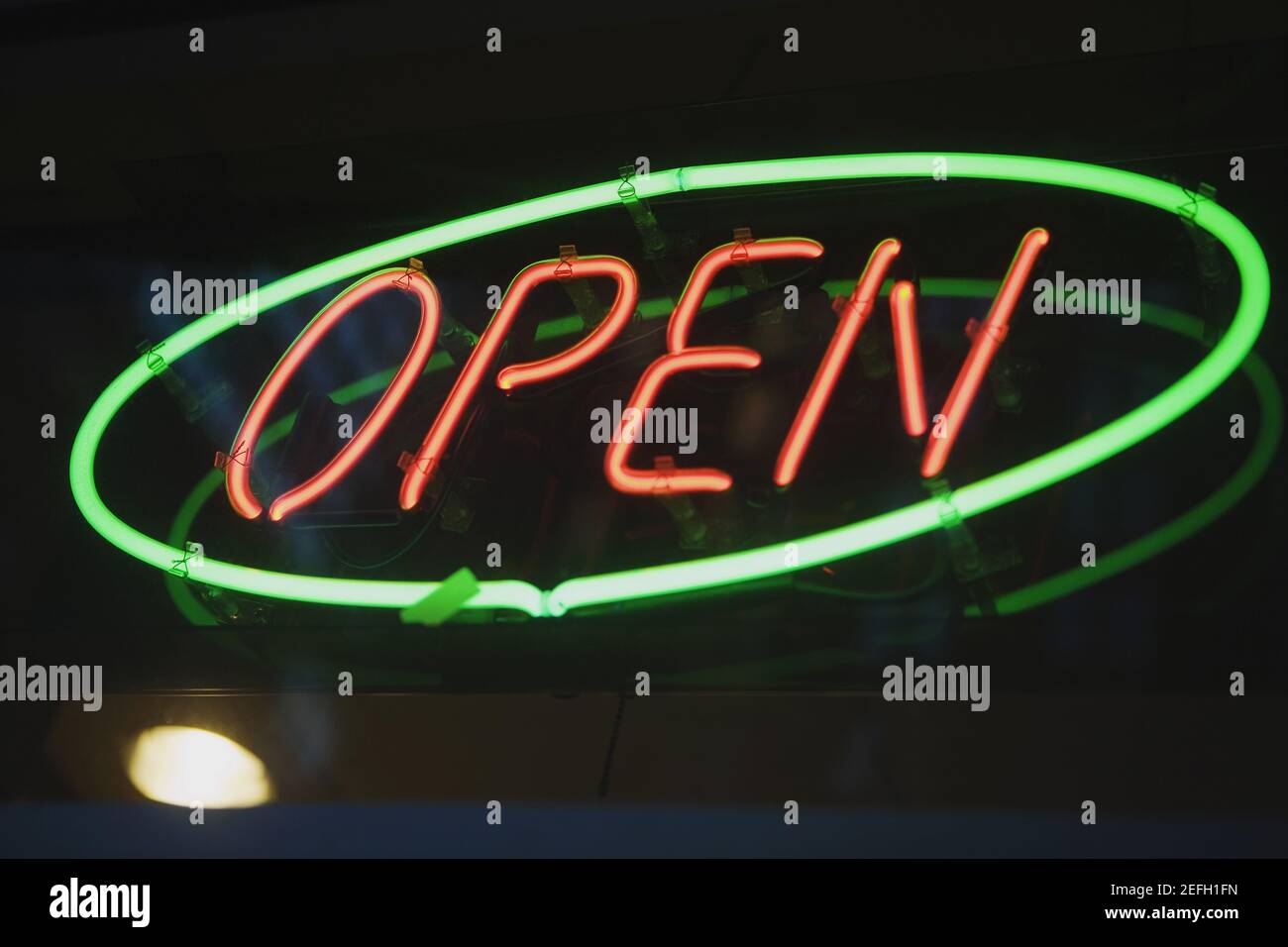 Close up of a neon open sign lit up at night Stock Photo - Alamy