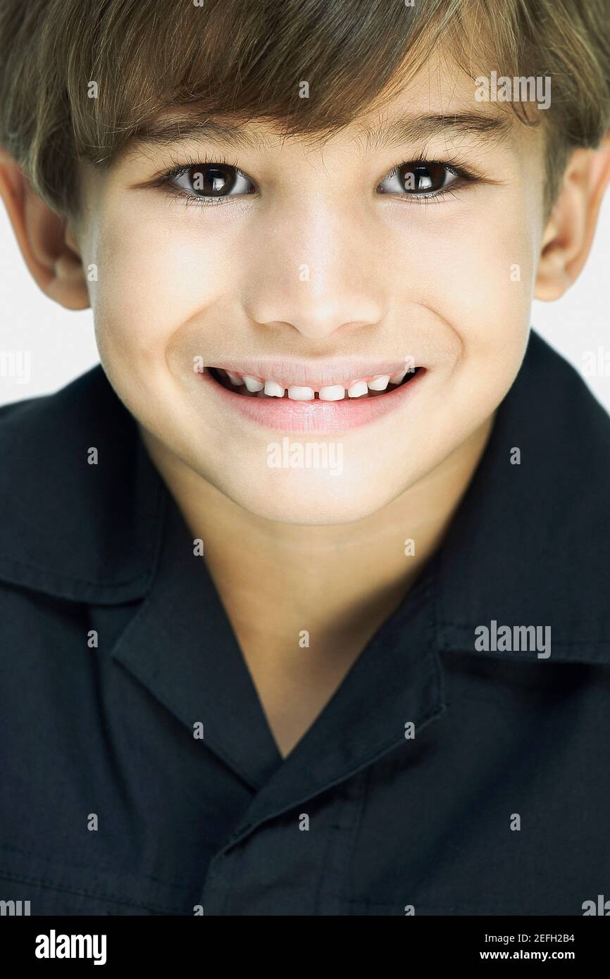 Portrait of a boy grinning Stock Photo - Alamy