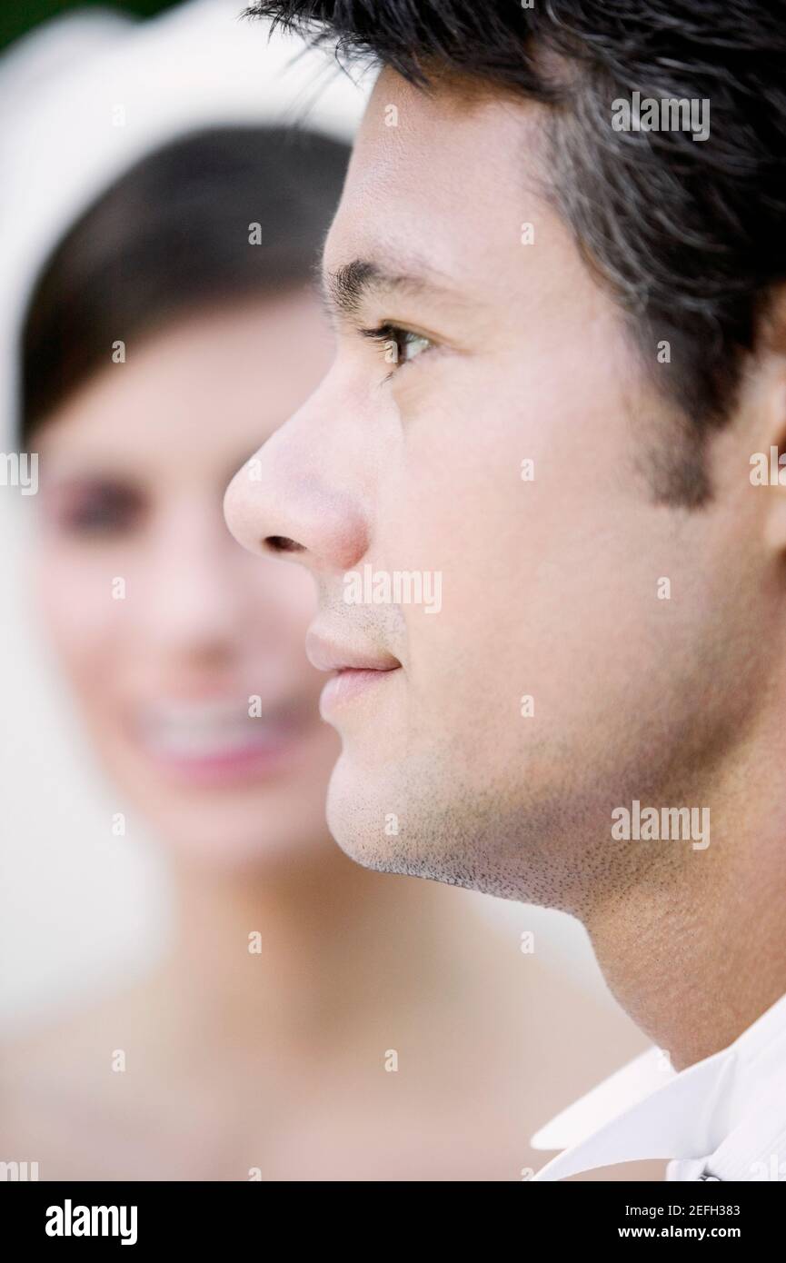 Side profile of a groom looking serious Stock Photo - Alamy
