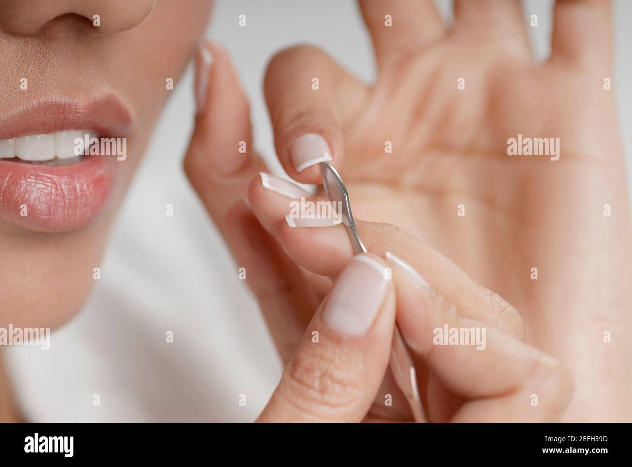 Cleaning fingernails hi-res stock photography and images - Alamy