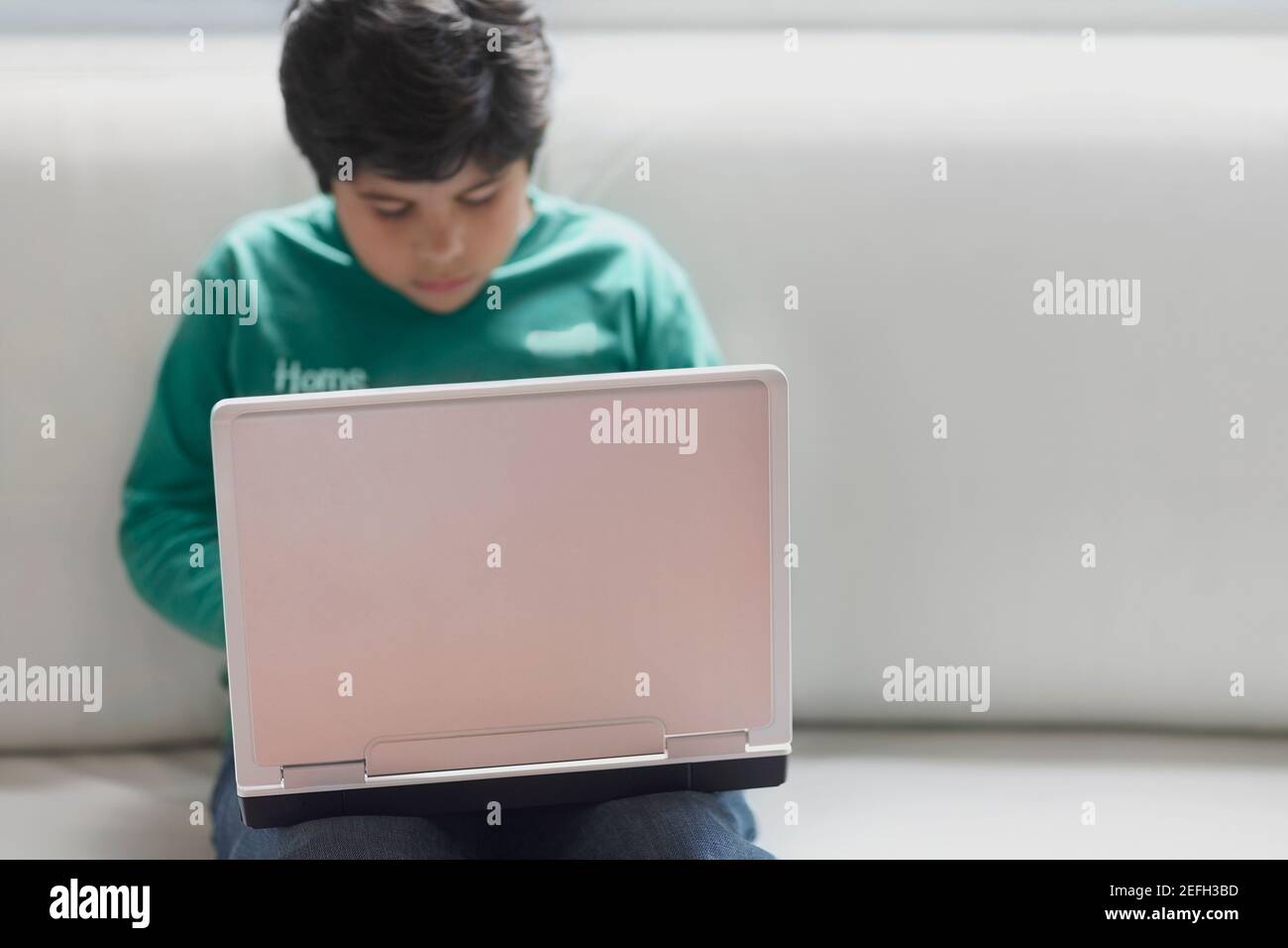 Close up of a boy using a laptop Stock Photo - Alamy