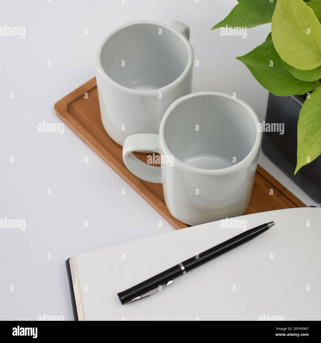 Two cups of coffee and notebook hi-res stock photography and images - Alamy