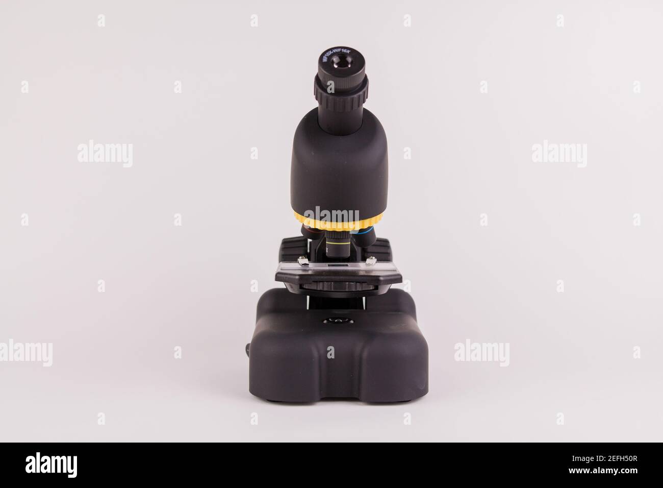 a black microscope on a white background to study the microworld Stock ...
