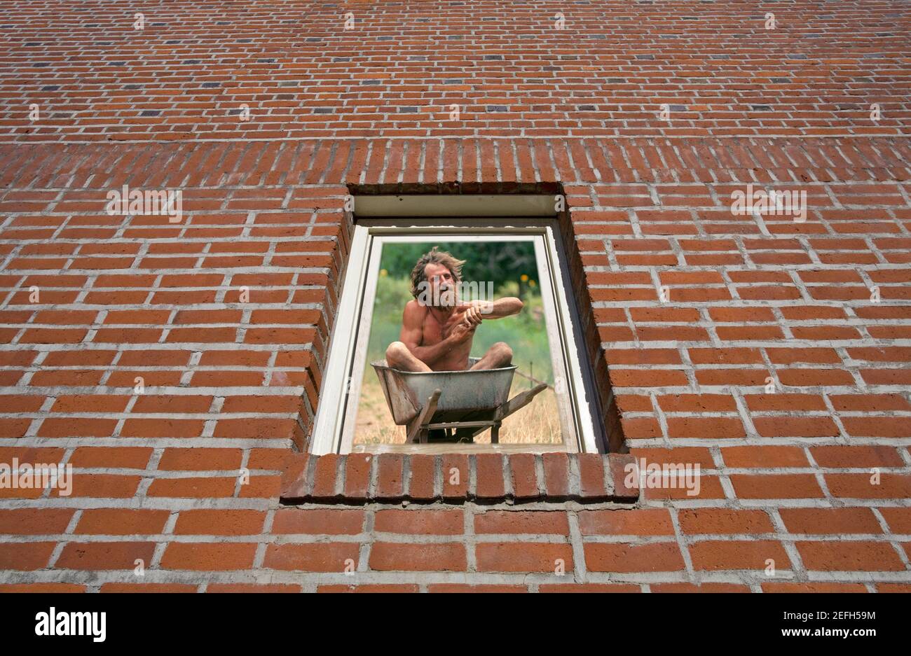 Brick through window hi-res stock photography and images - Alamy
