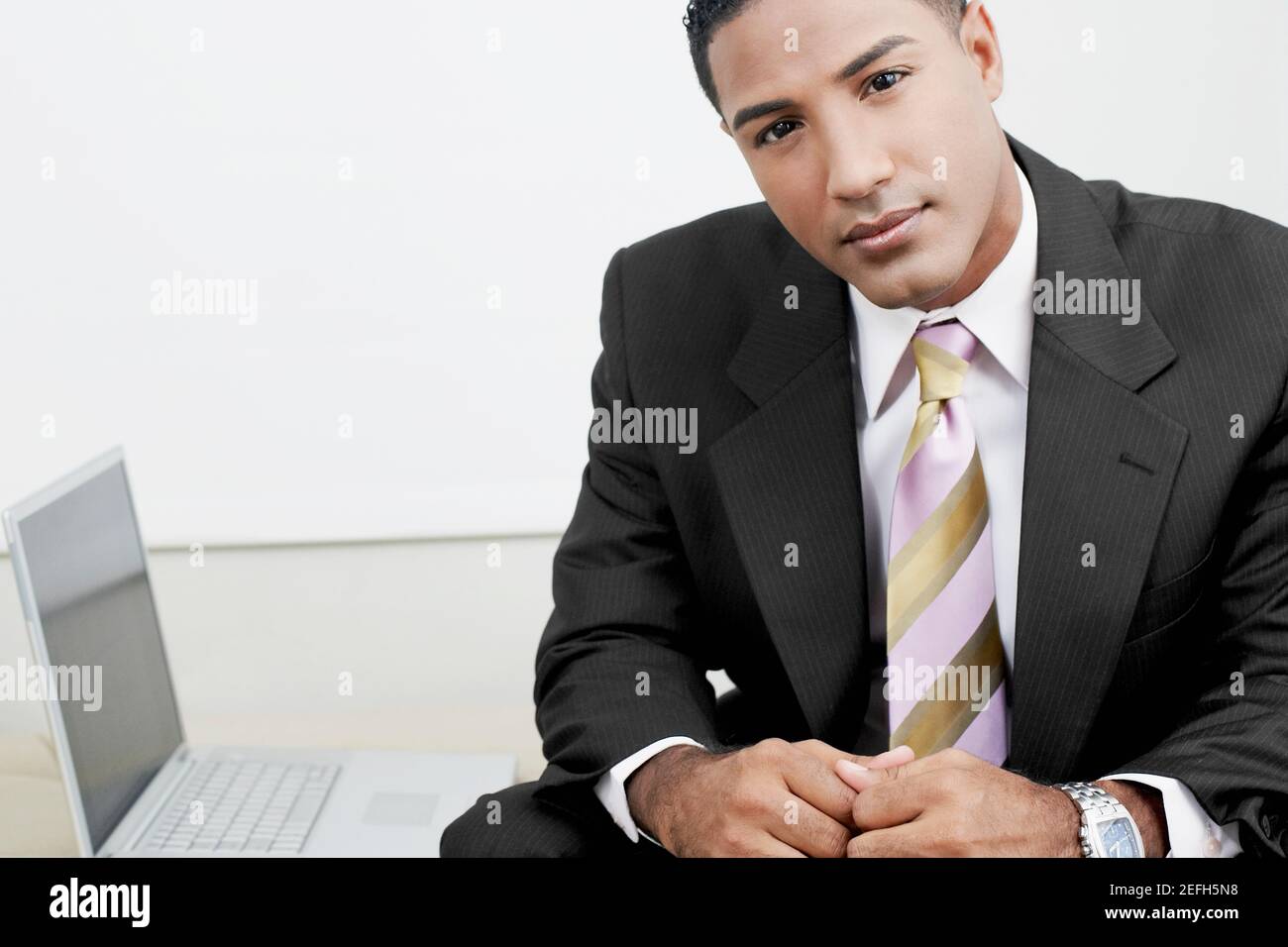 Portrait businessman sitting beside hi-res stock photography and images ...