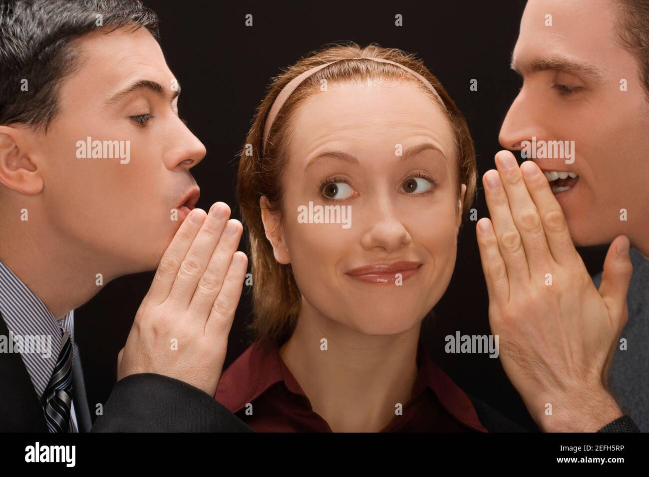 Whispering adults hi-res stock photography and images - Alamy