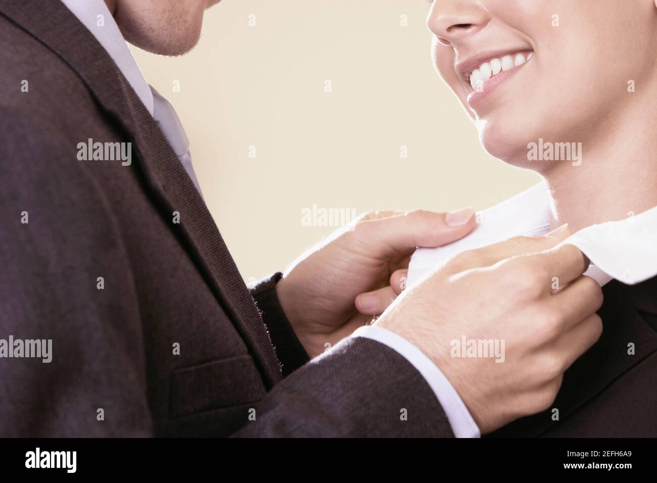 Woman adjusting shirt collar hi-res stock photography and images - Alamy