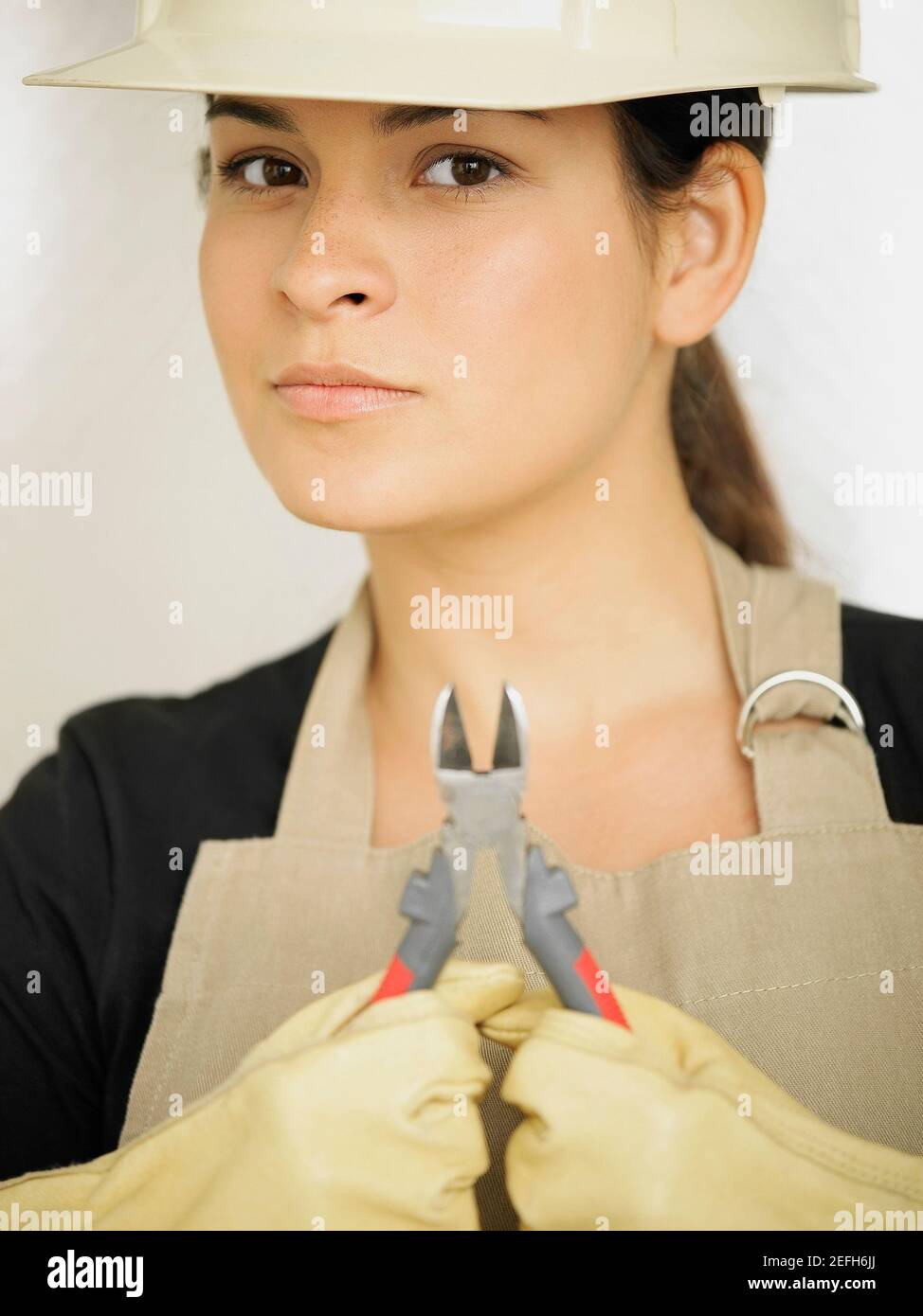 Female hand holding pliers hi-res stock photography and images - Alamy