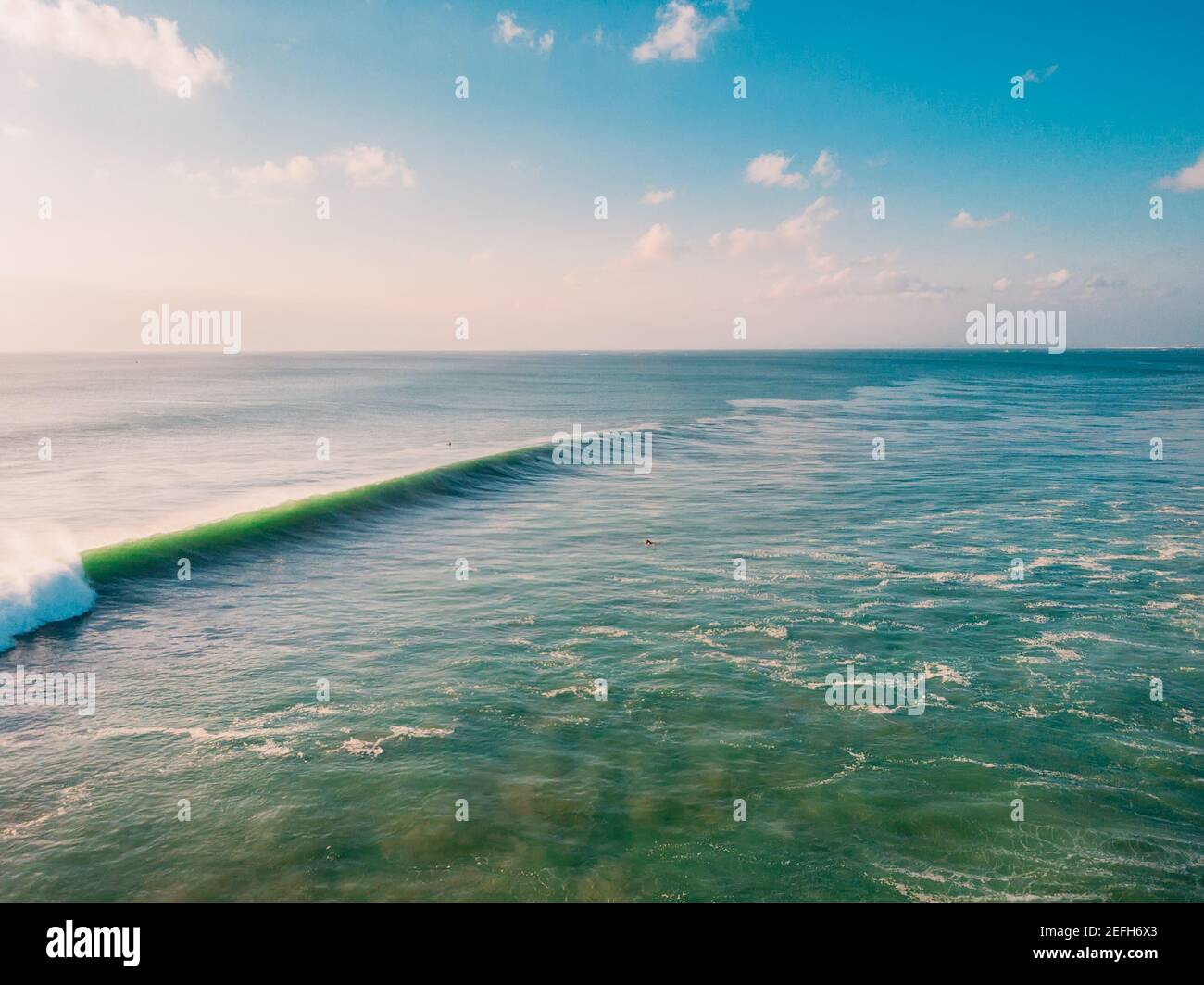 Aerial view of big wave with evening light. Biggest ocean waves in Bali ...