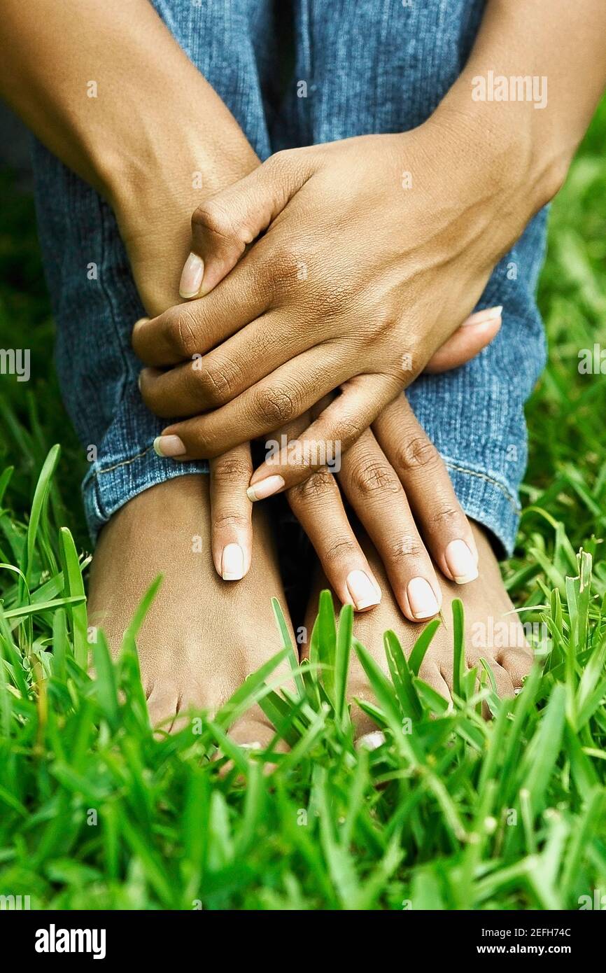 Woman hugging knee hi-res stock photography and images - Alamy