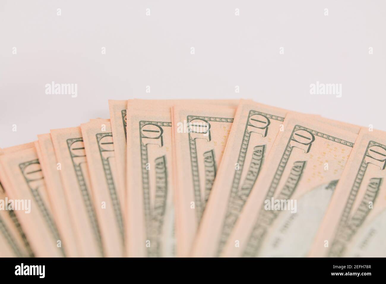 a ten dollar bills on white background Stock Photo - Alamy